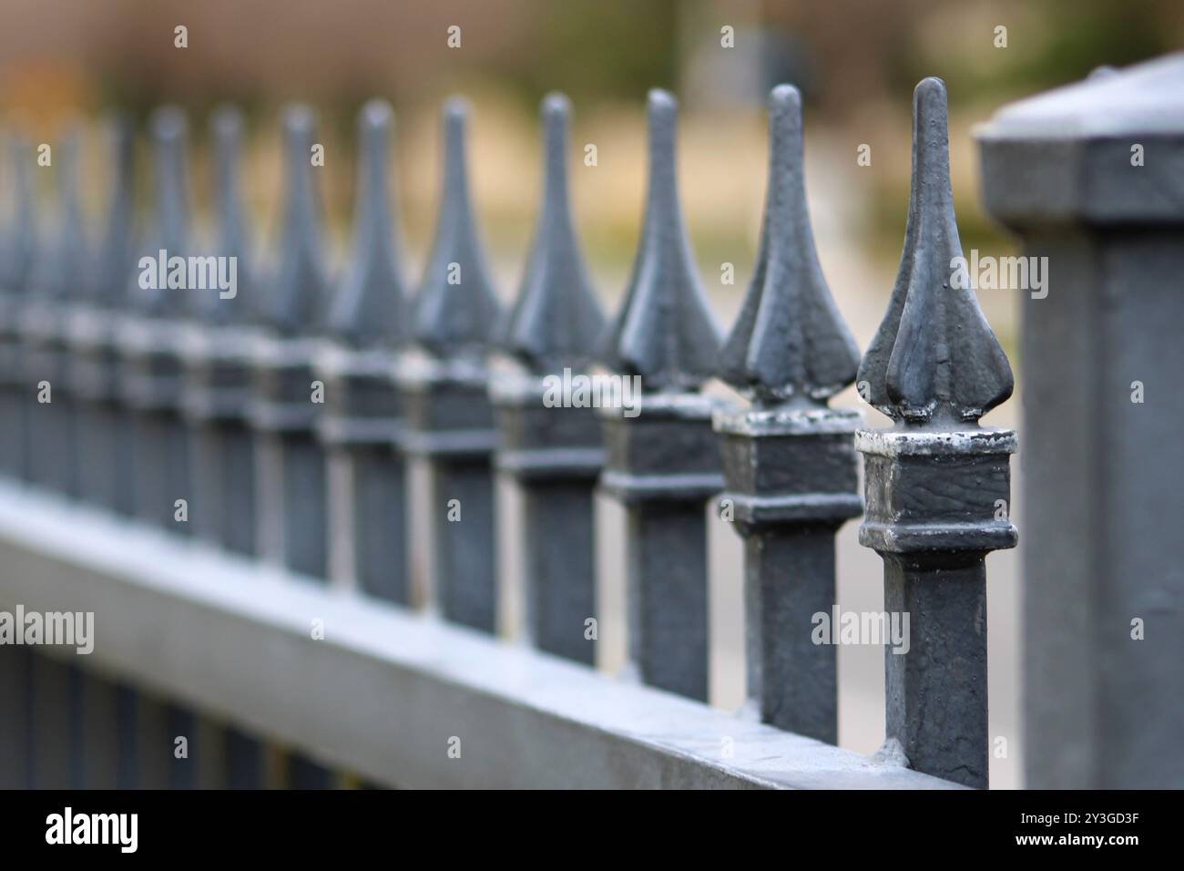 black wrought iron fence posts Stock Photo - Alamy