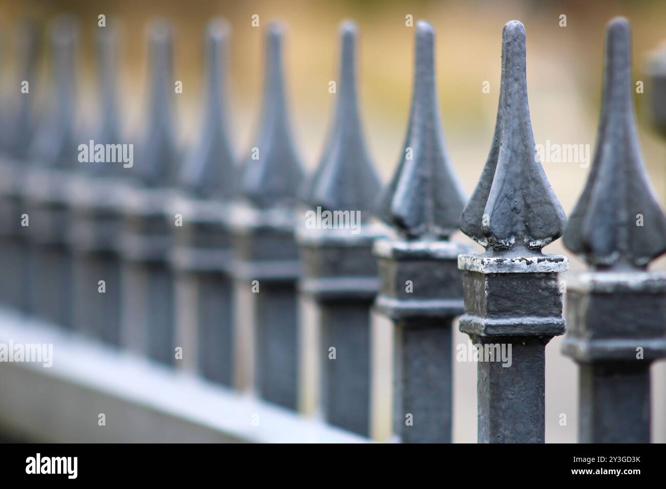 black wrought iron fence posts Stock Photo - Alamy