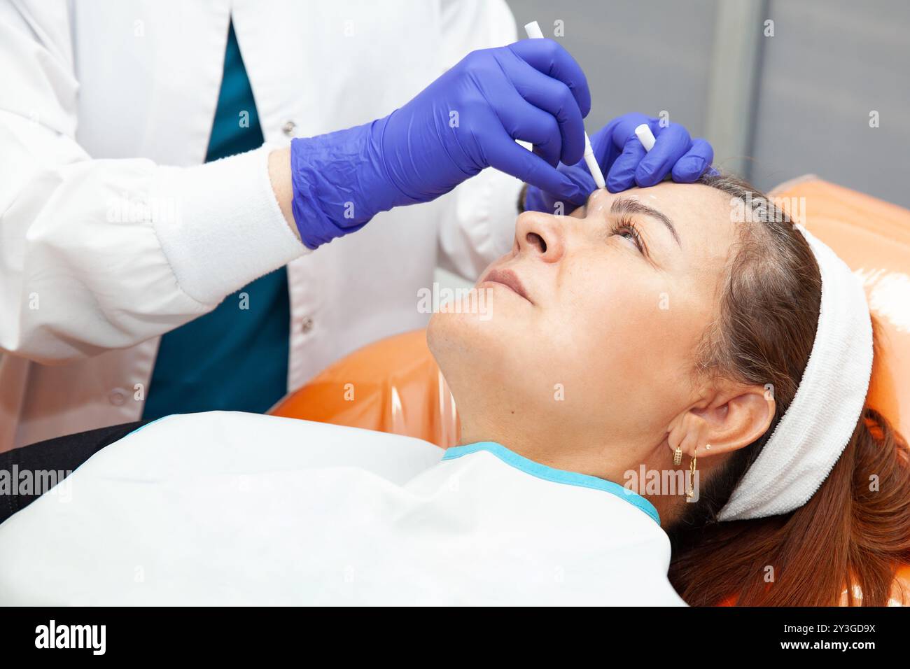 Dermatologist marking of injection points for botulinum toxin ...