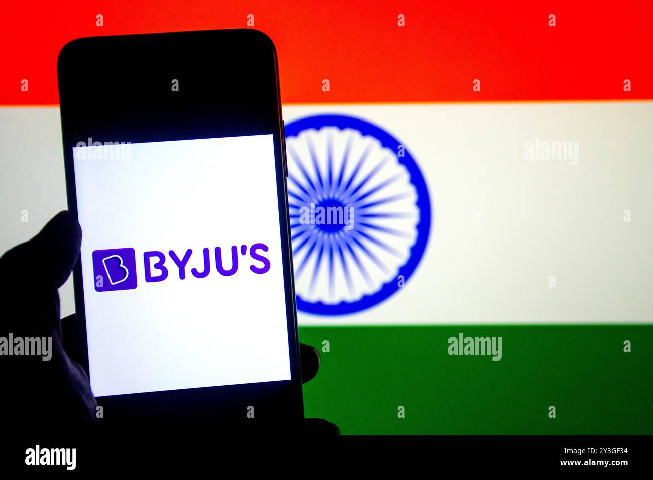 In this photo illustration, a BYJU's logo seen displayed on a ...