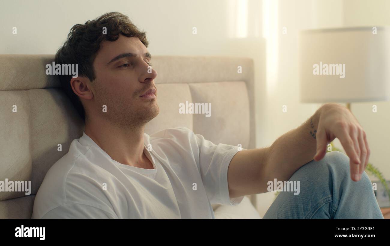 Tired exhausted young man sighing hi-res stock photography and images ...