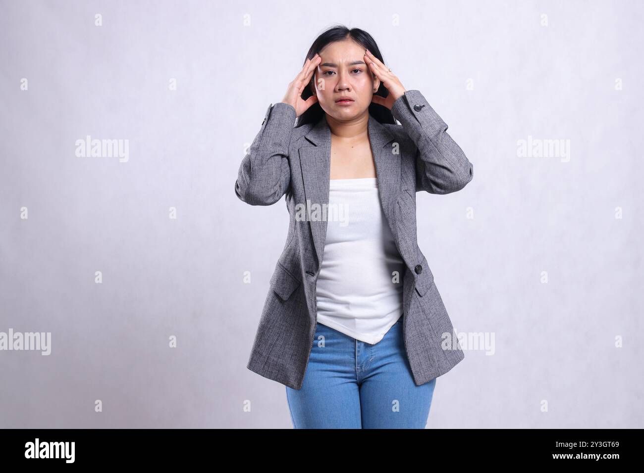 expression of beautiful young office woman weak dizzy both hands ...