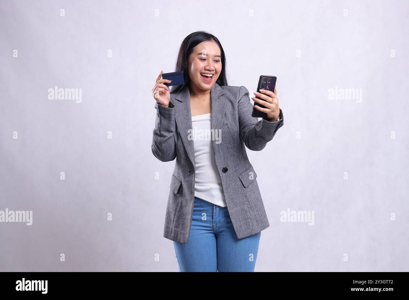 beautiful young office girl happy to handphone hold cellphone ...