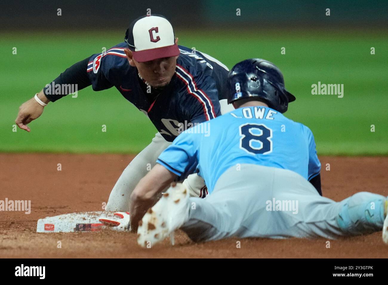 Cleveland Guardians second baseman Andres Gimenez, left, tags out Tampa ...
