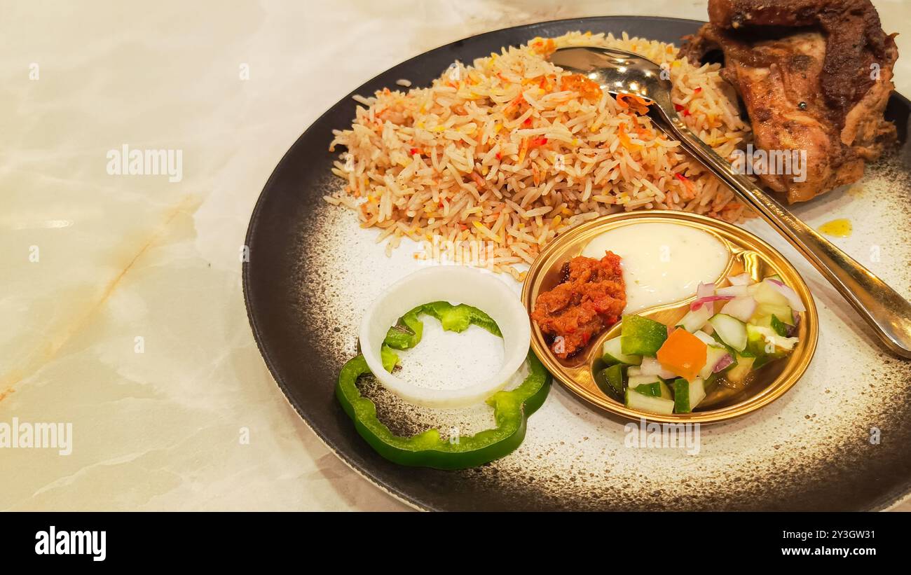Kebuli rice (nasi kebuli) closeup of Arabic food on the table with ...