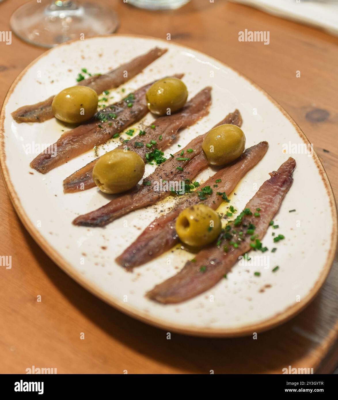 Spanish anchovy dish with olives Stock Photo - Alamy