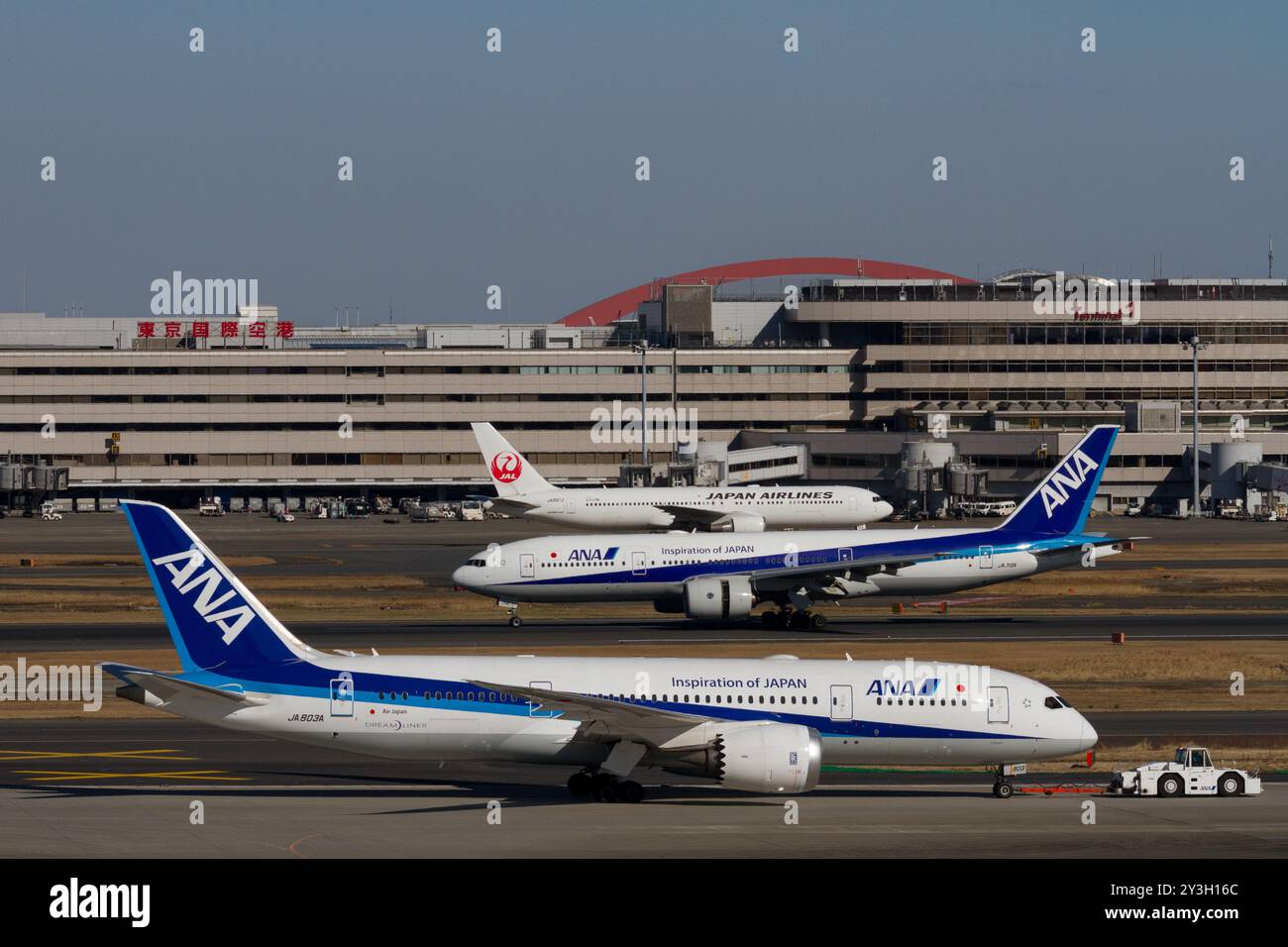 An All Nippon Airways (ANA) Boeing 787 Dreamliner with an ANA Boeing 777-281 and JAL Boeing 767 ...