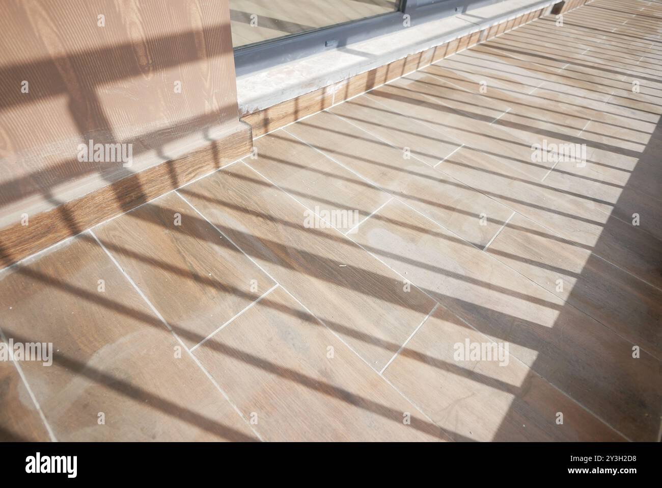 A Sunlit Outdoor Terrace Featuring Beautiful Shadow Patterns and ...