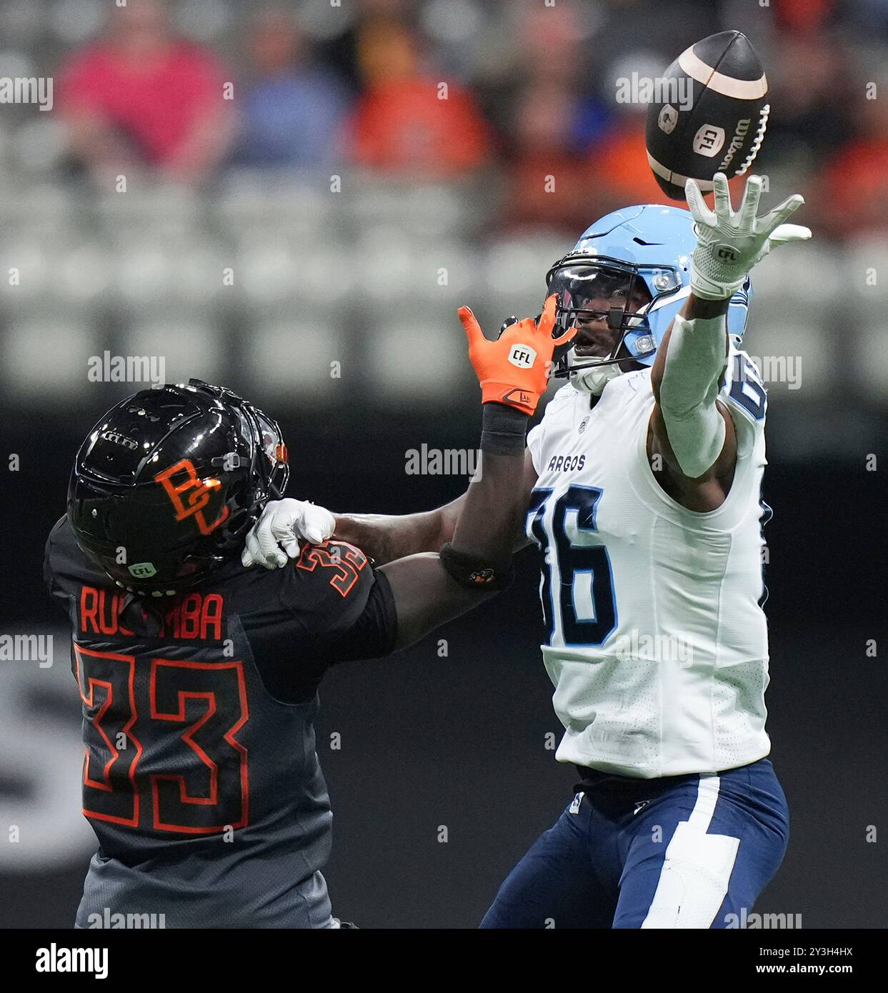 Toronto Argonauts' Damonte Coxie, right, bobbles the ball and fails to ...