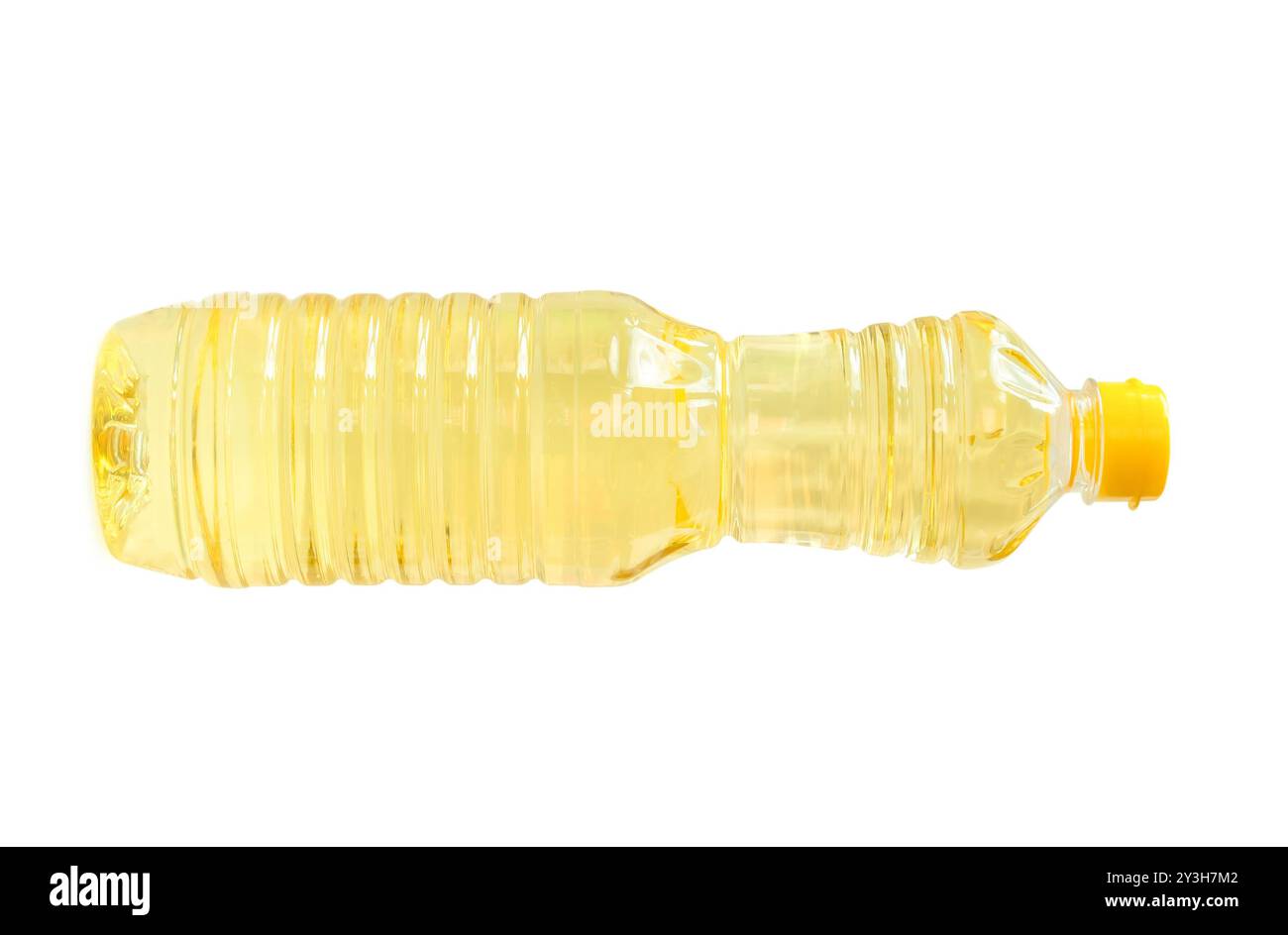Light yellow cooking or vegetable oil in small plastic bottle is ...