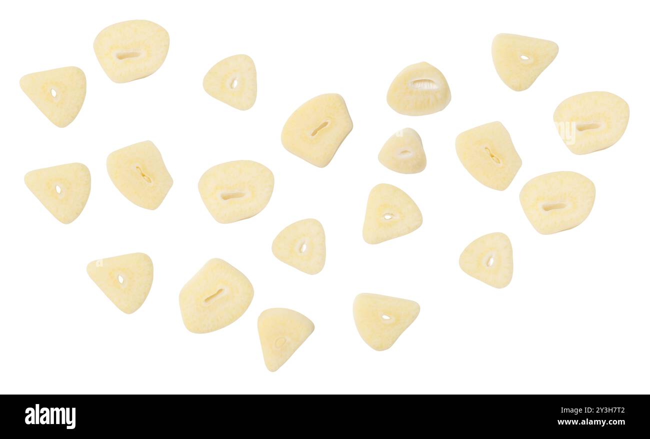 Top view set of fresh peeled white garlic slices or pieces scattering ...