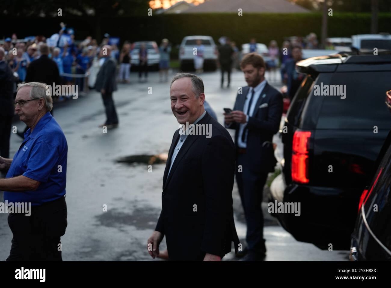 Second gentleman Doug Emhoff looks toward golf carts lined up to parade ...