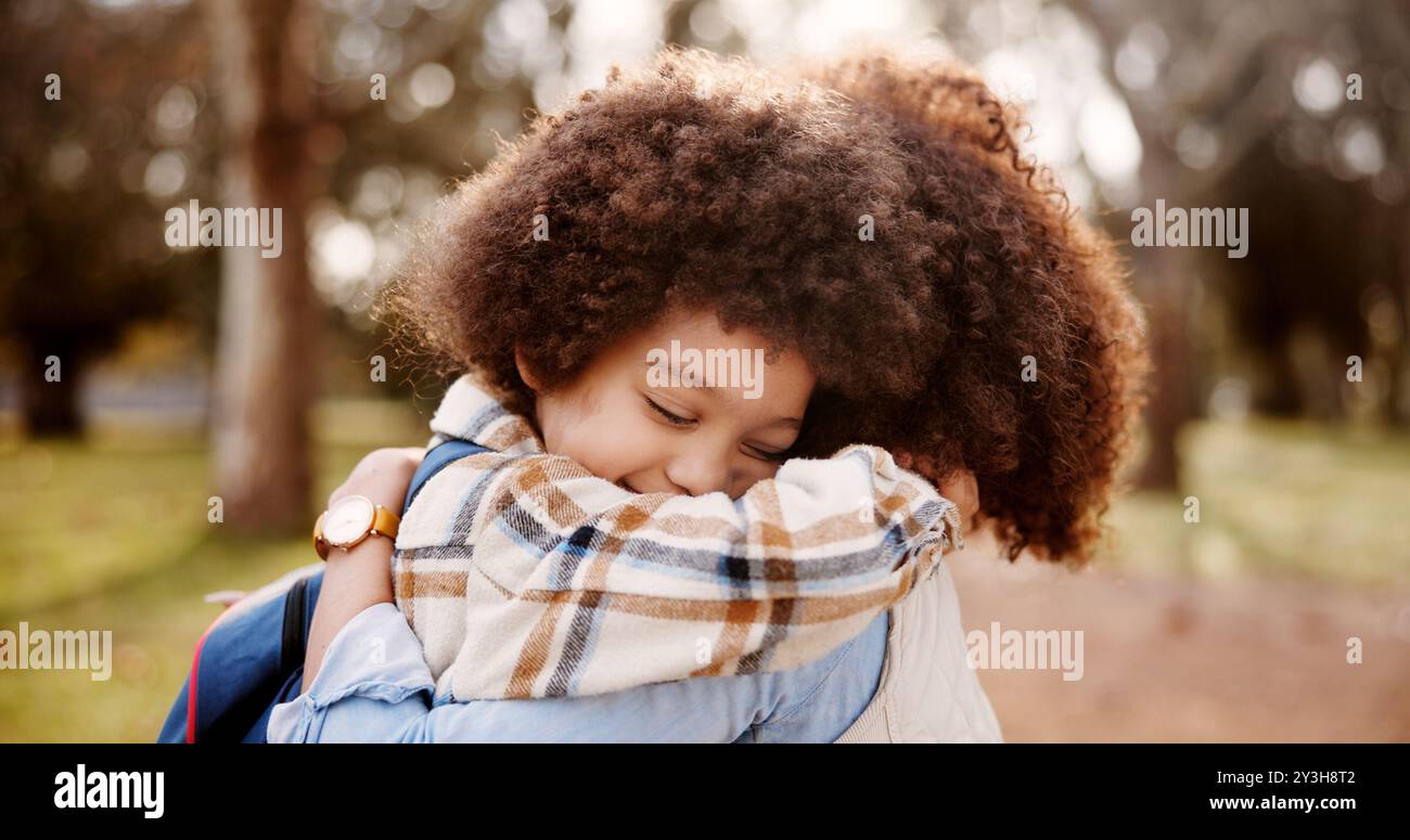 Park, mother and child with backpack for hug, bonding together and ...