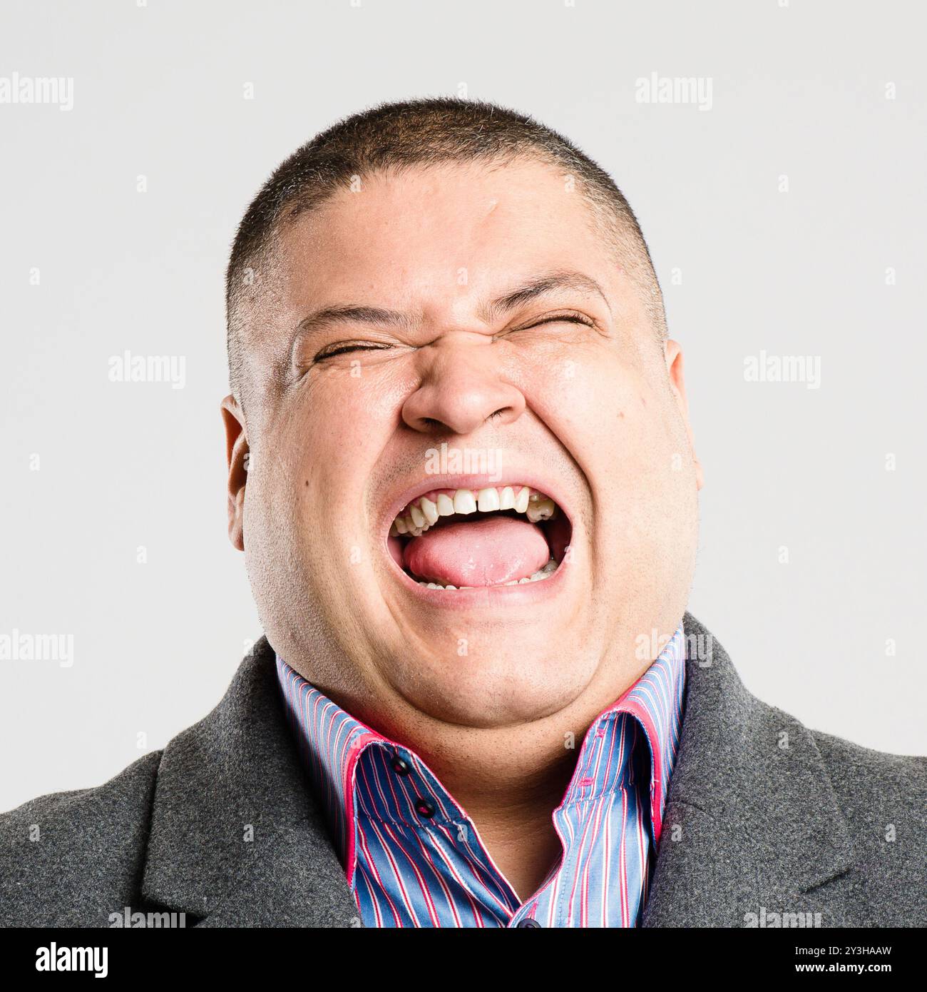 Business man, happy and laughing in studio for funny joke, comedy and ...