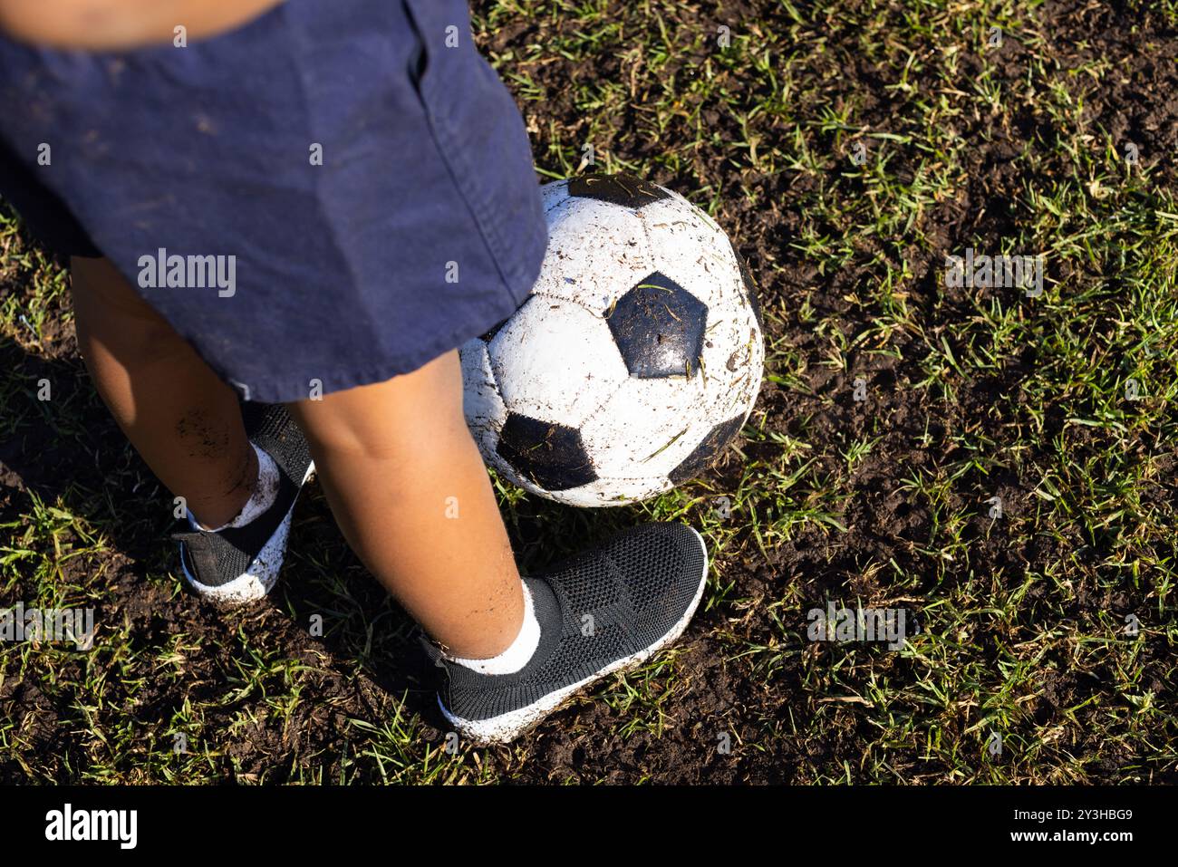 Outdoors, Playing soccer on grass field, african american boy wearing ...