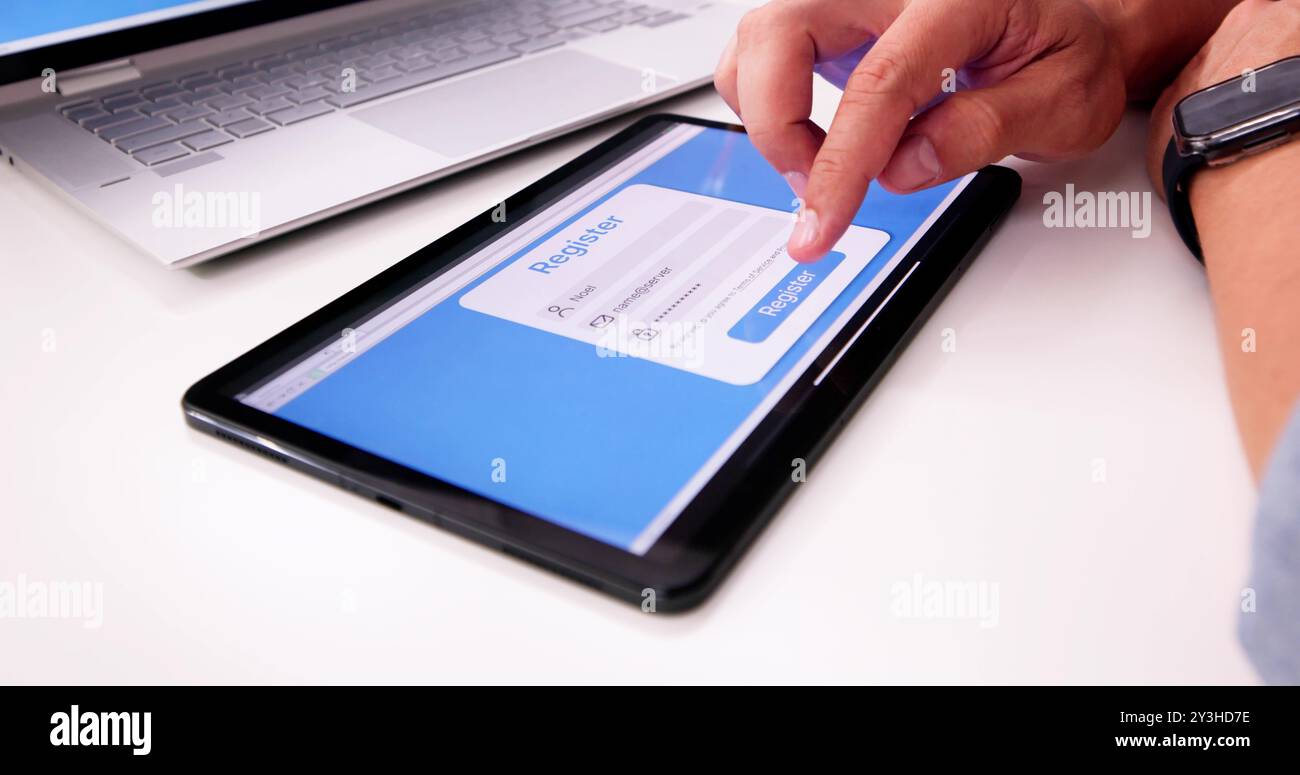 Businessman's Hand Filing Online Registration Form On Laptop Stock ...