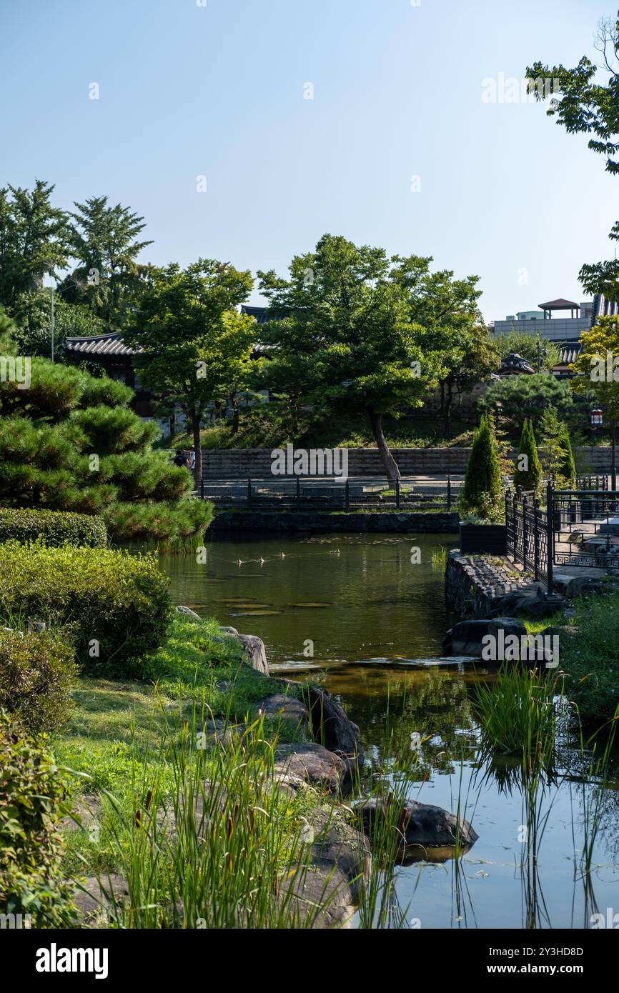 View of the pond and garden in Namsangol Hanok village, a recreated ...
