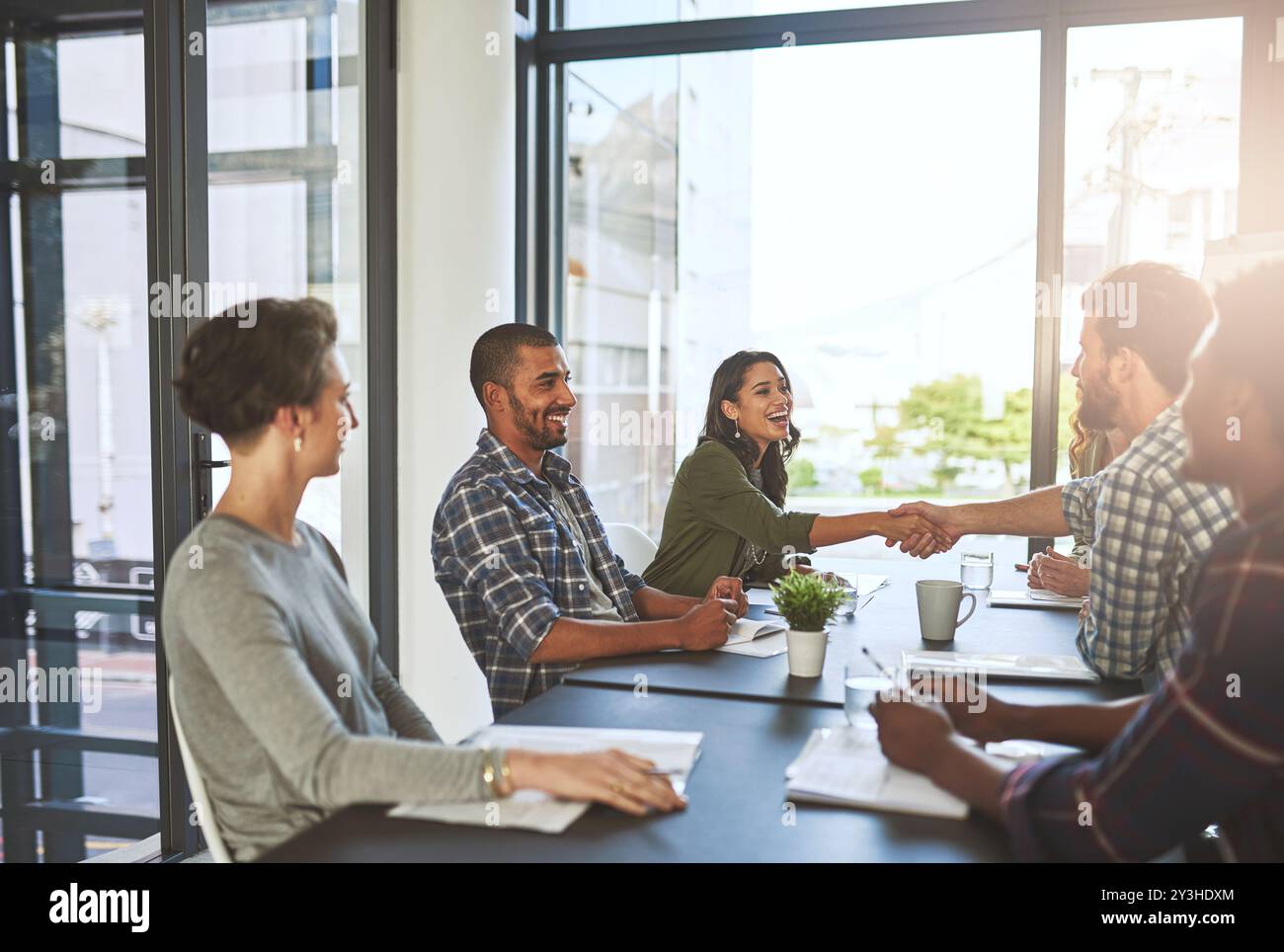 Employees, shaking hands and respect in boardroom for client ...