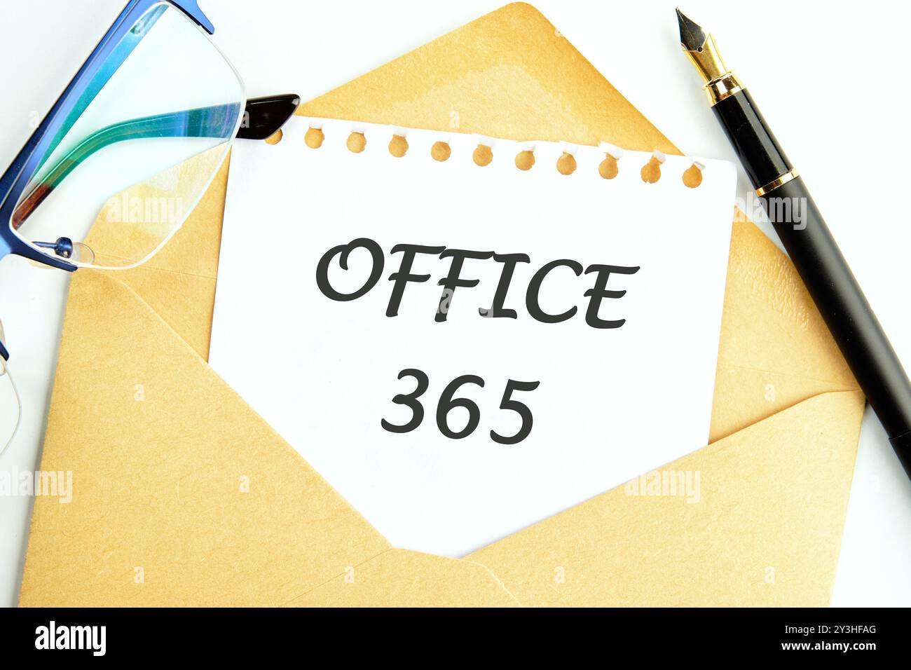 OFFICE 365 words written on a white sheet of notepad sticking out of an ...