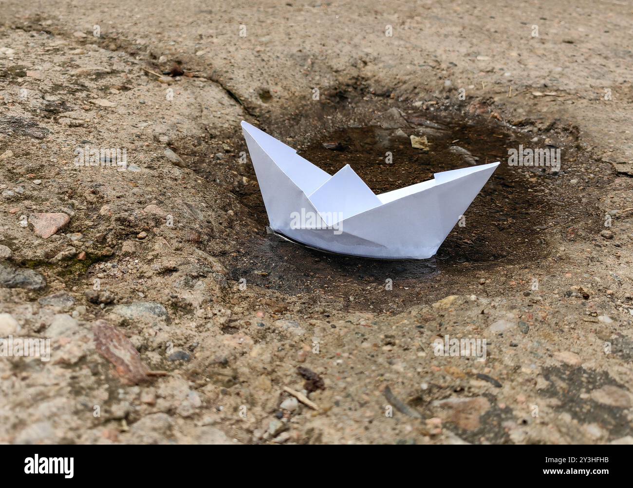 Tiny World: Paper Boat Sailing After Rain. Children play Stock Photo ...