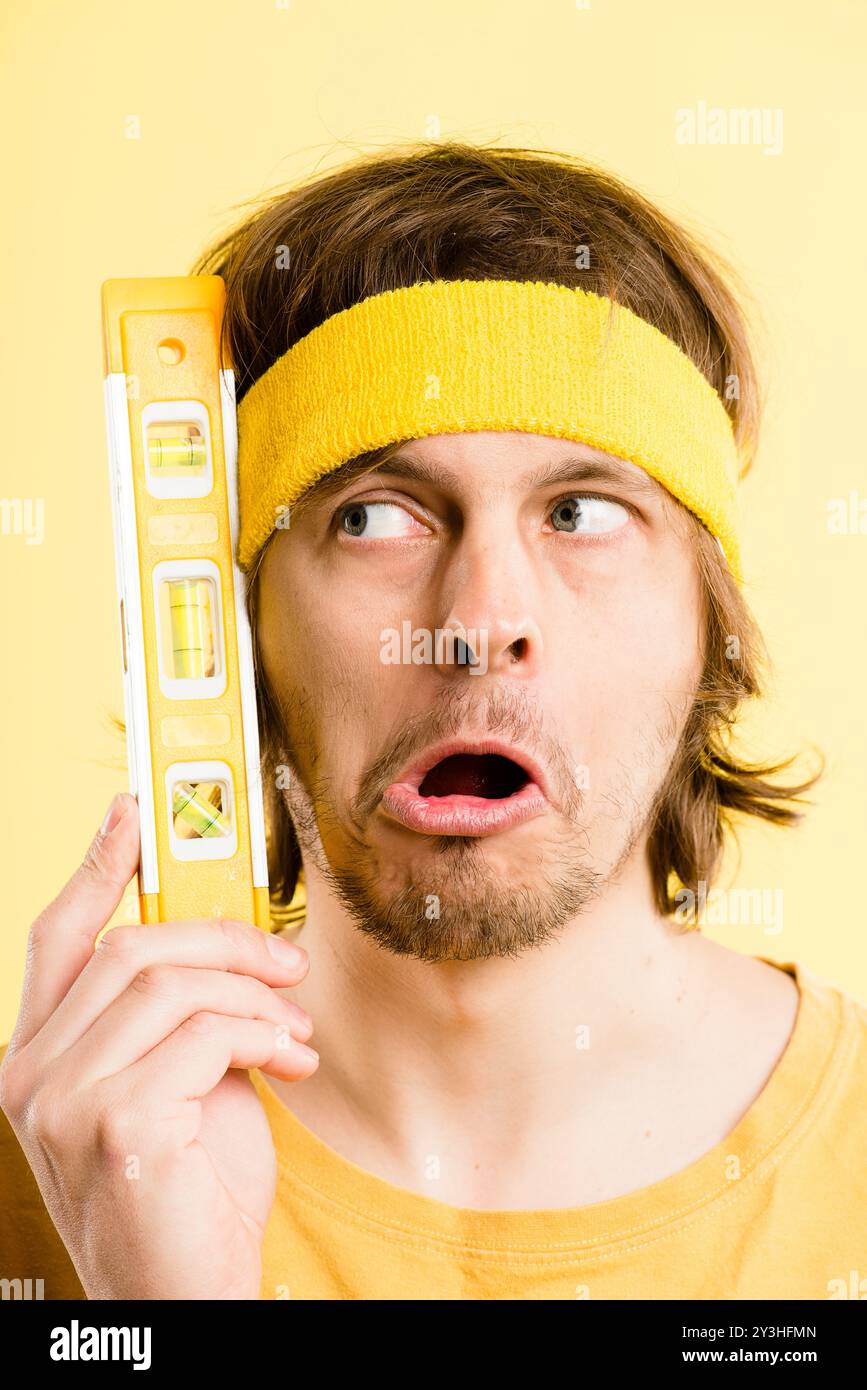 Thinking, goofy and face of man in studio with funny, comic and facial ...