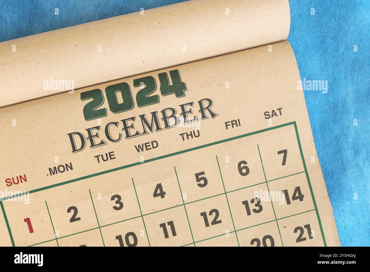 December 2024 calendar flat lay in blue background with copy space ...