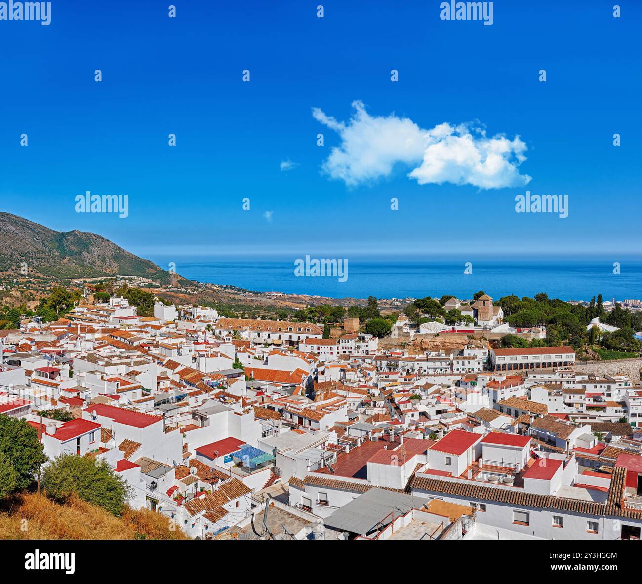 Mountain, buildings and city in Spain by ocean with urban structures ...