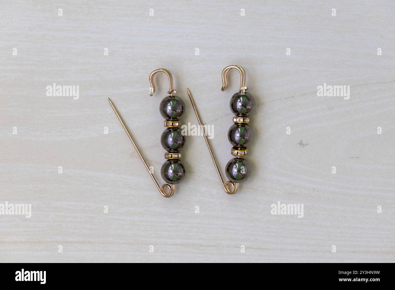 Beautiful safety pins made of shiny beads and stones. Safety pins can ...