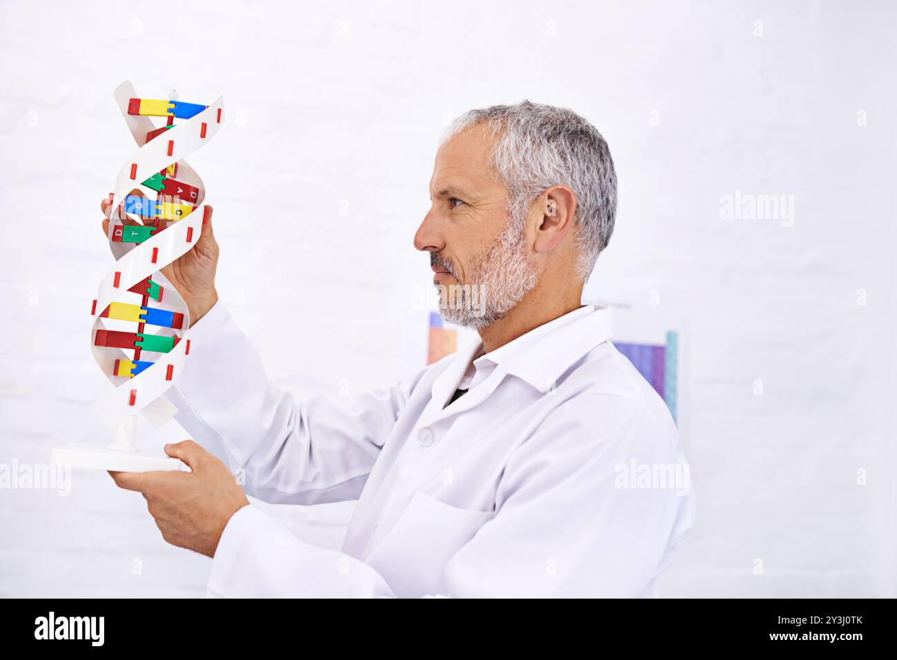 Mature scientist, man and research with DNA model, lab and thinking ...