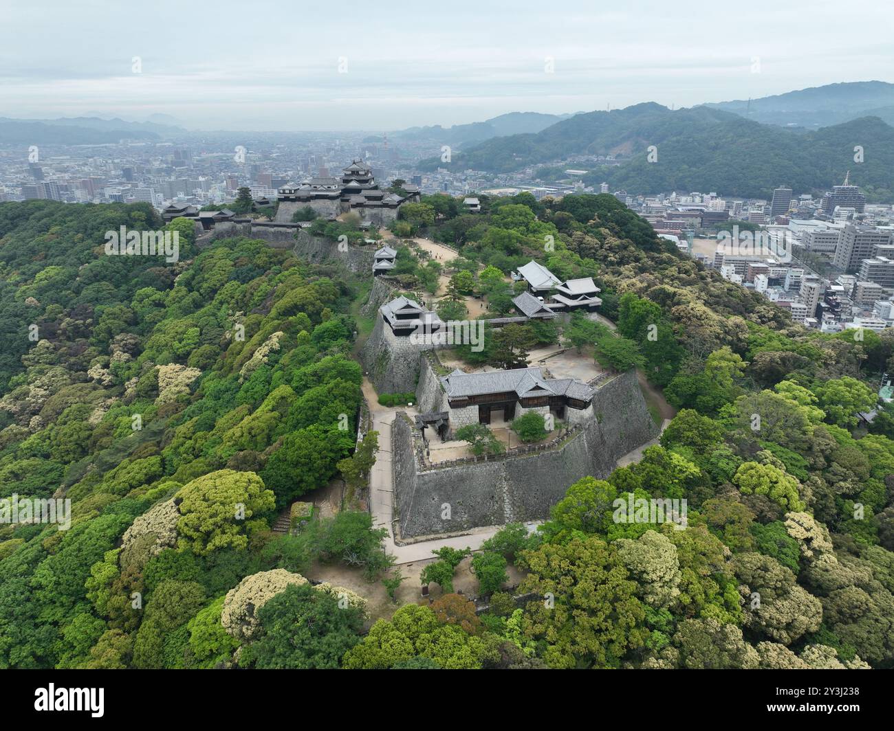 Aerial Image of Matsuyama Castle on an overcast day Stock Photo - Alamy