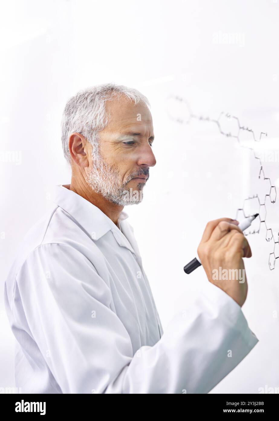 Man, writing and science by glass wall with notes for formula ...