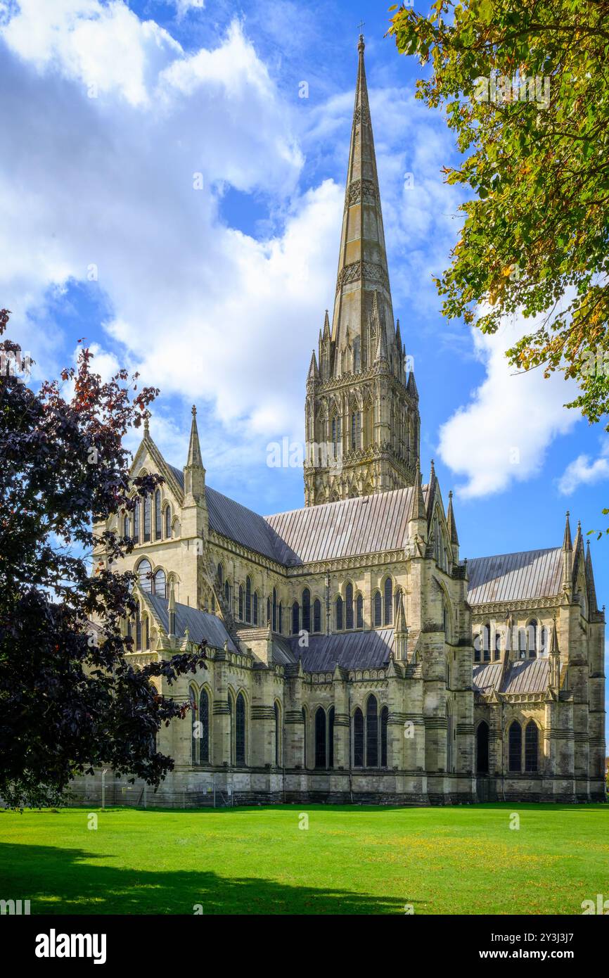 Salisbury Cathedral set against a beautiful blue sky dotted with fluffy ...