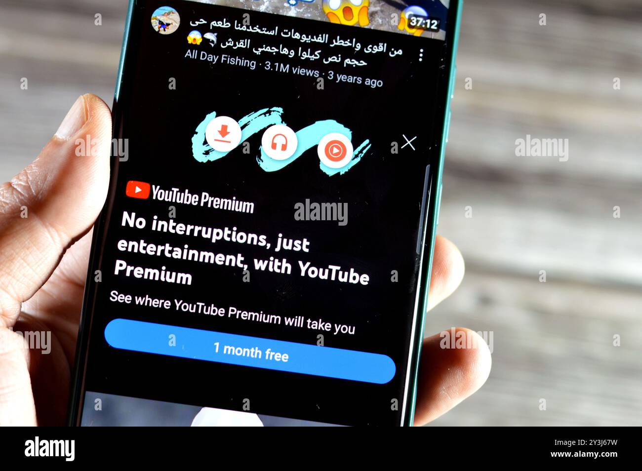 Cairo, Egypt, August 27 2024: YouTube premium 1 month free offer on a mobile phone screen ...