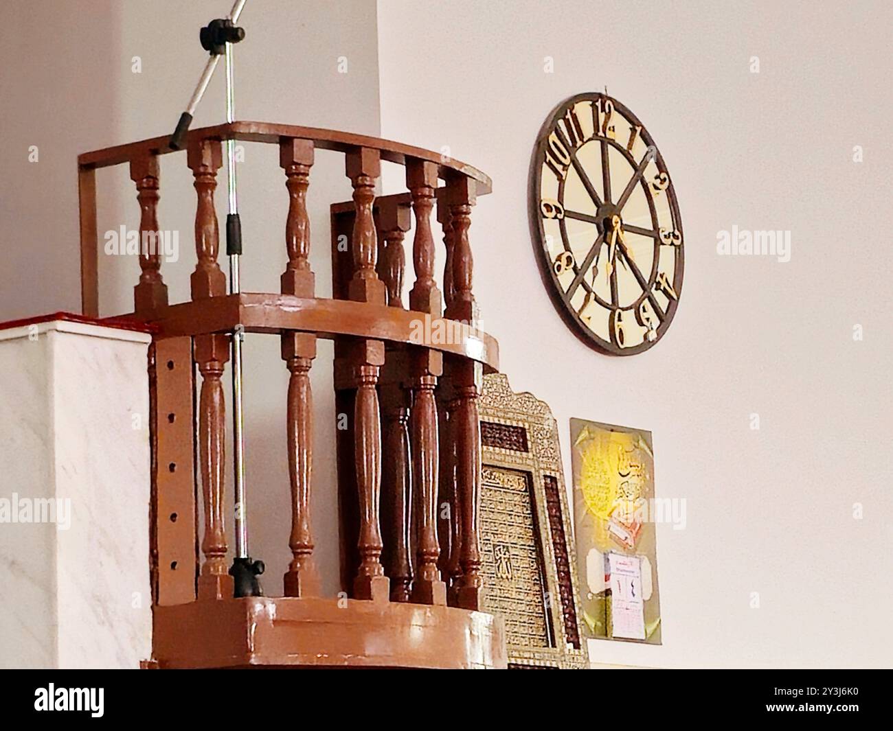 Cairo, Egypt, September 4 2024: Mosque pulpit and a wall mounted clock ...