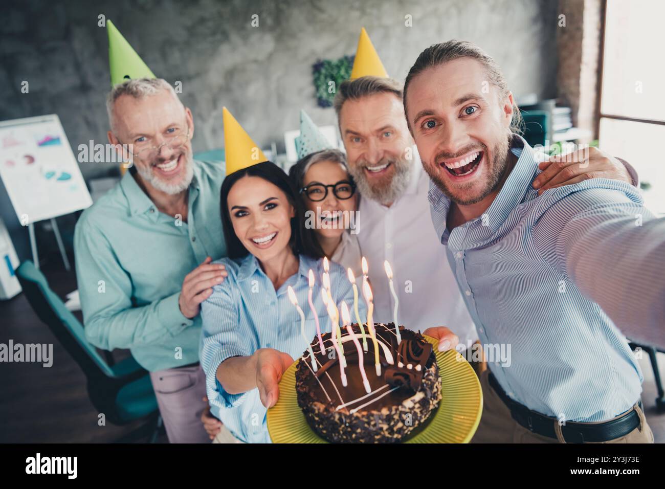 Photo of five successful corporate colleagues embrace hold birthday ...