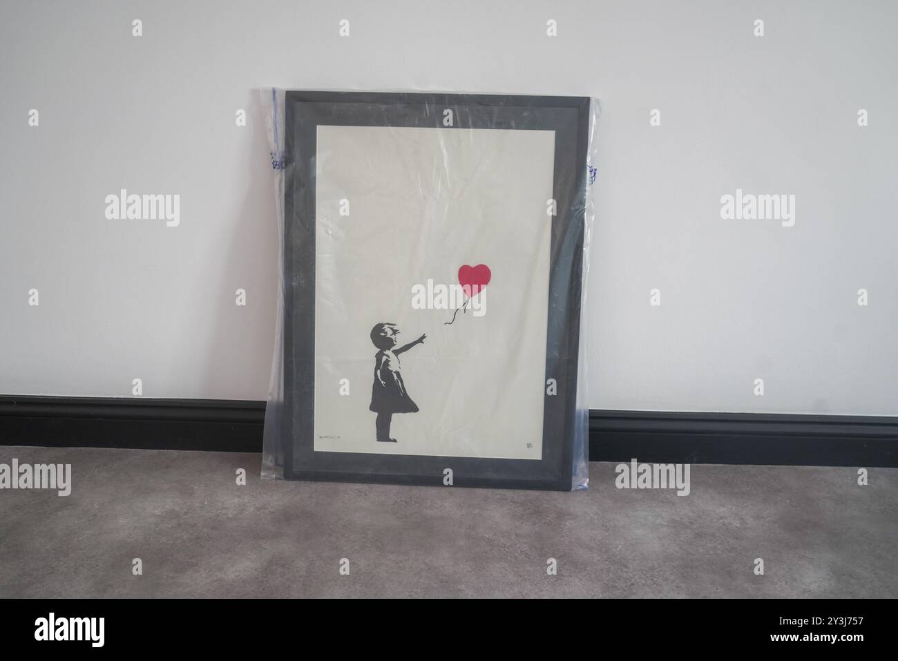 London, UK. 14 September 2024 . The stolen Banksy artwork Girl with a ...