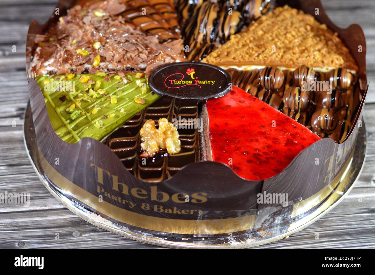 Cairo, Egypt, August 29 2024: Spongy cake pieces with assorted toppings ...