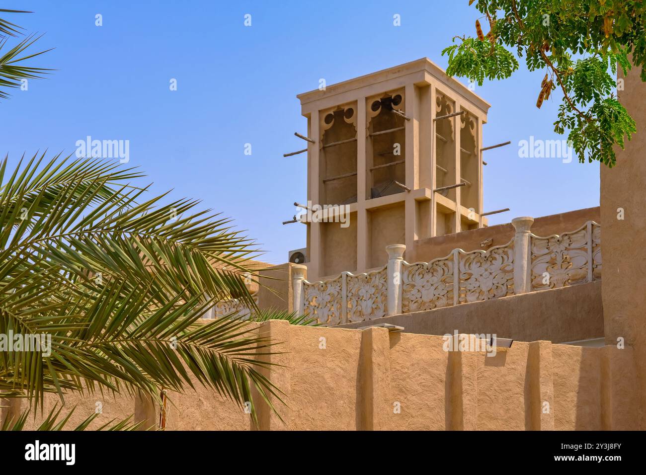 Traditional Arabic house with wind catcher tower or Barjeel for cross ...