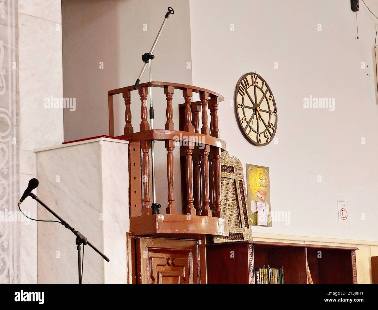 Cairo, Egypt, September 4 2024: Mosque pulpit and a wall mounted clock ...