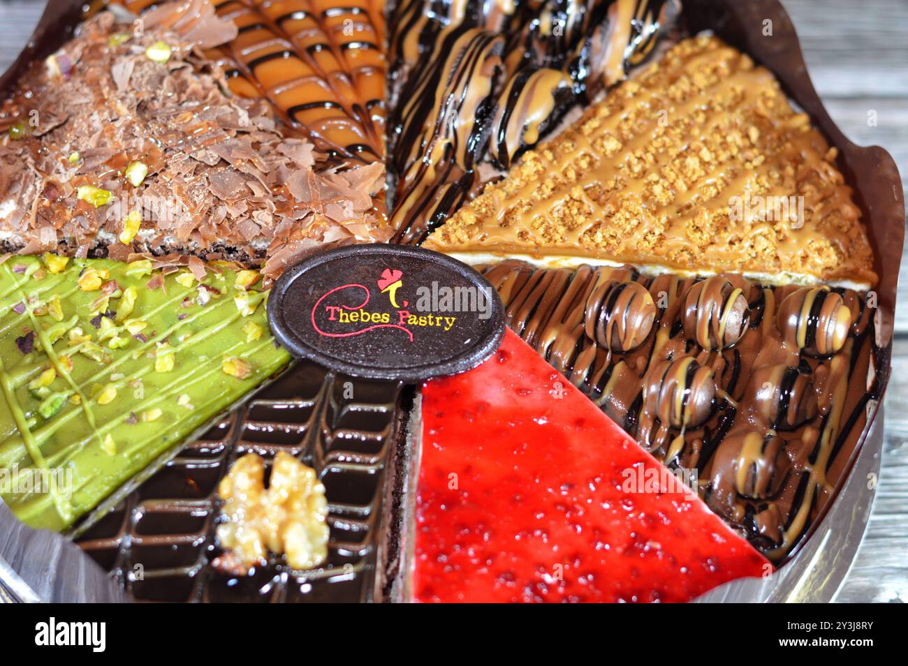 Cairo, Egypt, August 29 2024: Spongy cake pieces with assorted toppings ...