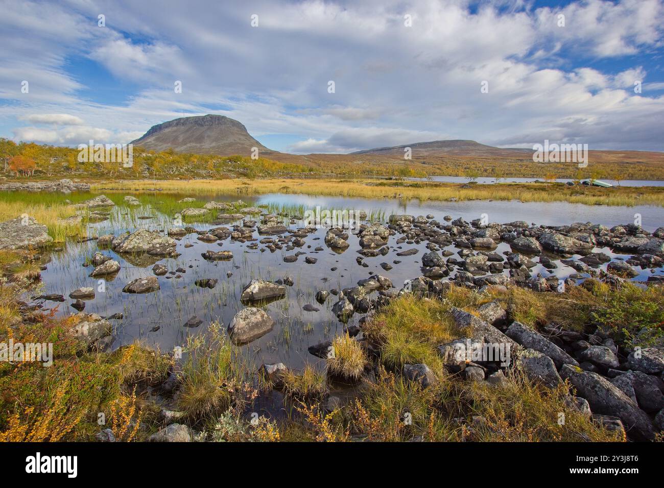 Autumn view of Saana Fell from Tsahkal Lake near Kilpisjarvi village ...