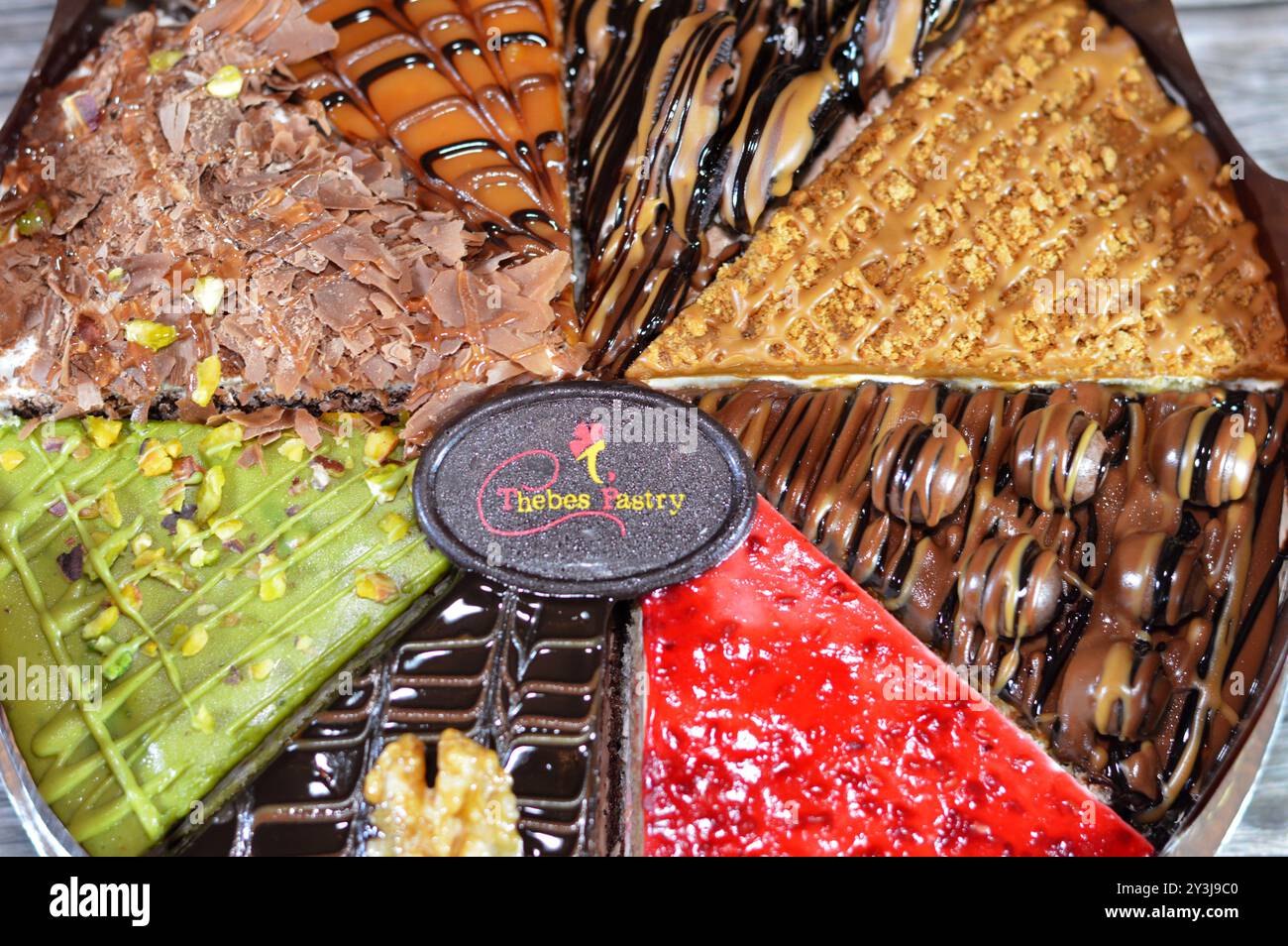 Cairo, Egypt, August 29 2024: Spongy cake pieces with assorted toppings ...