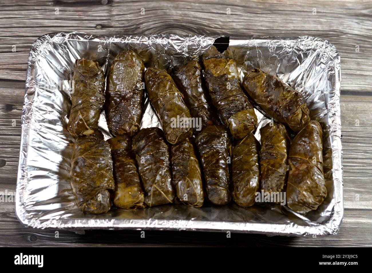 A plate of wrapped grape leaves stuffed Egyptian Mahshi and filled with ...