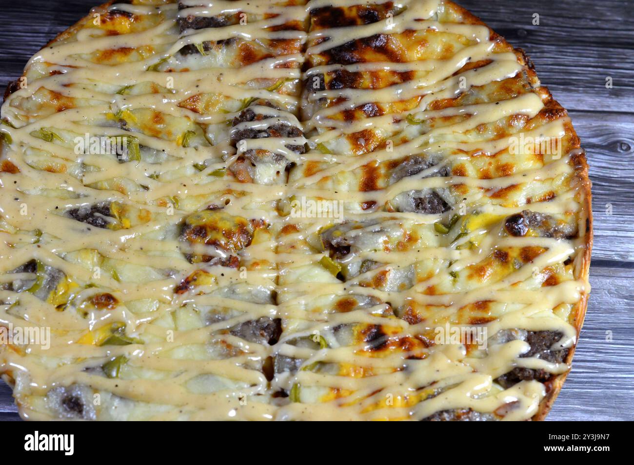 Smoky burger pizza, with thick crust dough, beef burger bites pieces ...