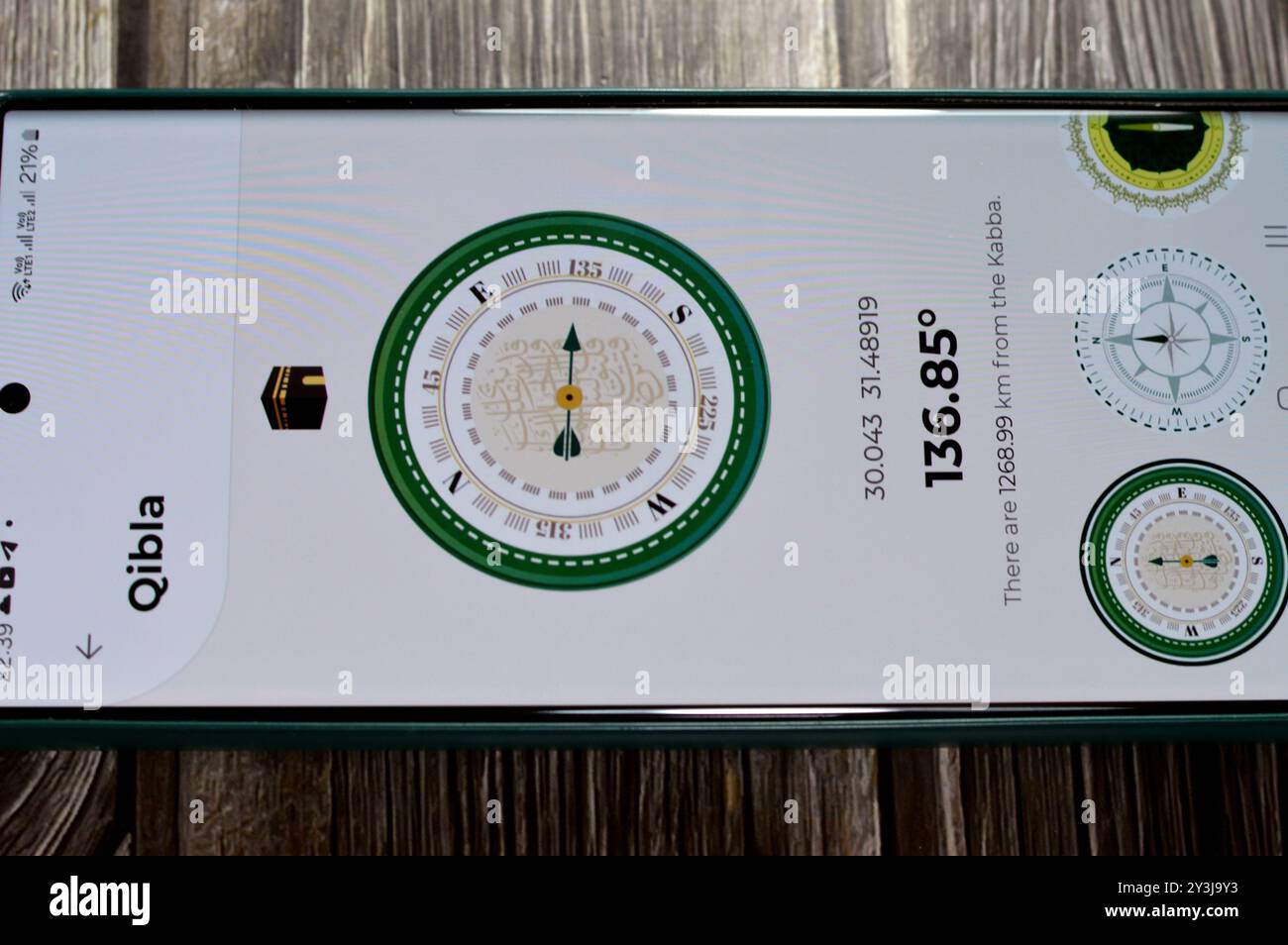 Cairo, Egypt, August 27 2024: Qibla direction towards Kaaba by a mobile smartphone application ...