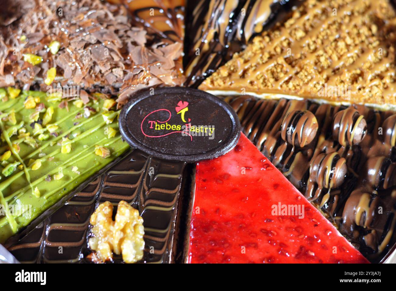 Cairo, Egypt, August 29 2024: Spongy cake pieces with assorted toppings ...