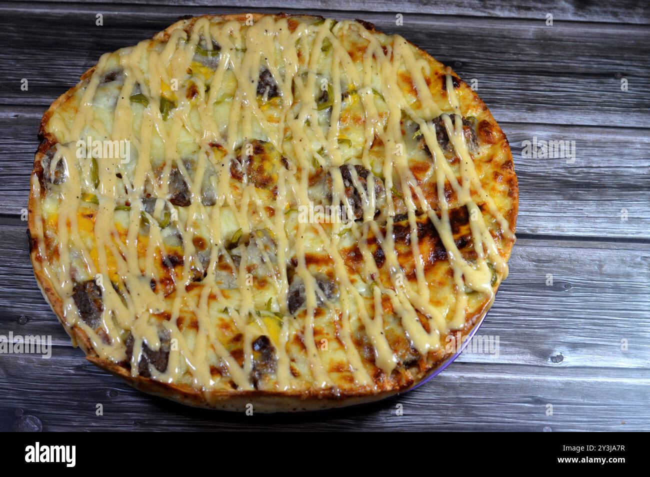 Smoky burger pizza, with thick crust dough, beef burger bites pieces ...