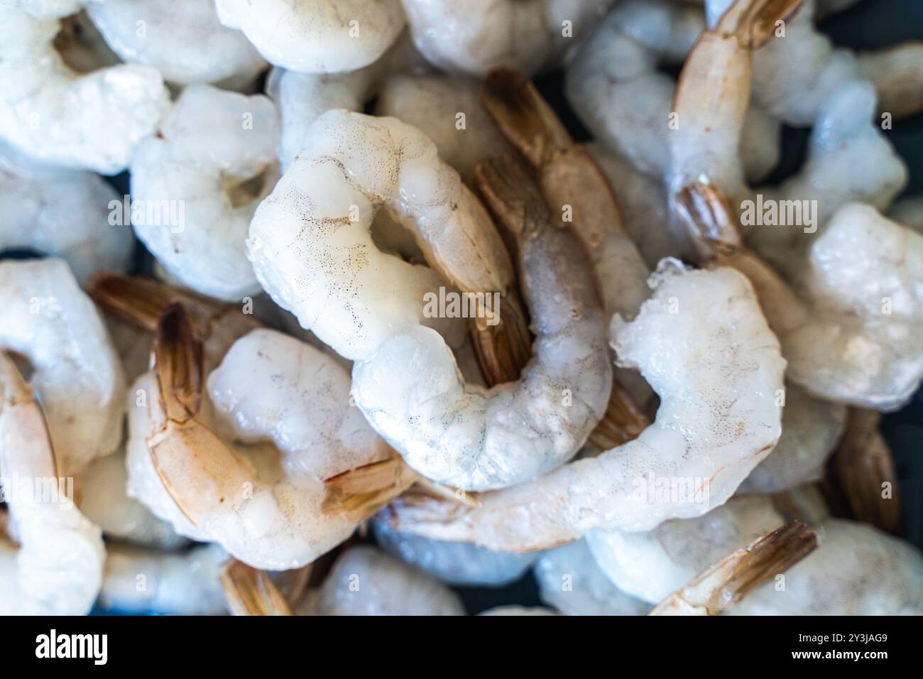 Frozen, raw shrimp. Texture: King Prawns background. Seafood on the ...