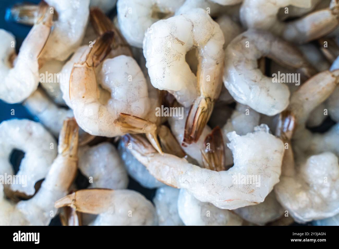 Frozen, raw shrimp. Texture: King Prawns background. Seafood on the ...