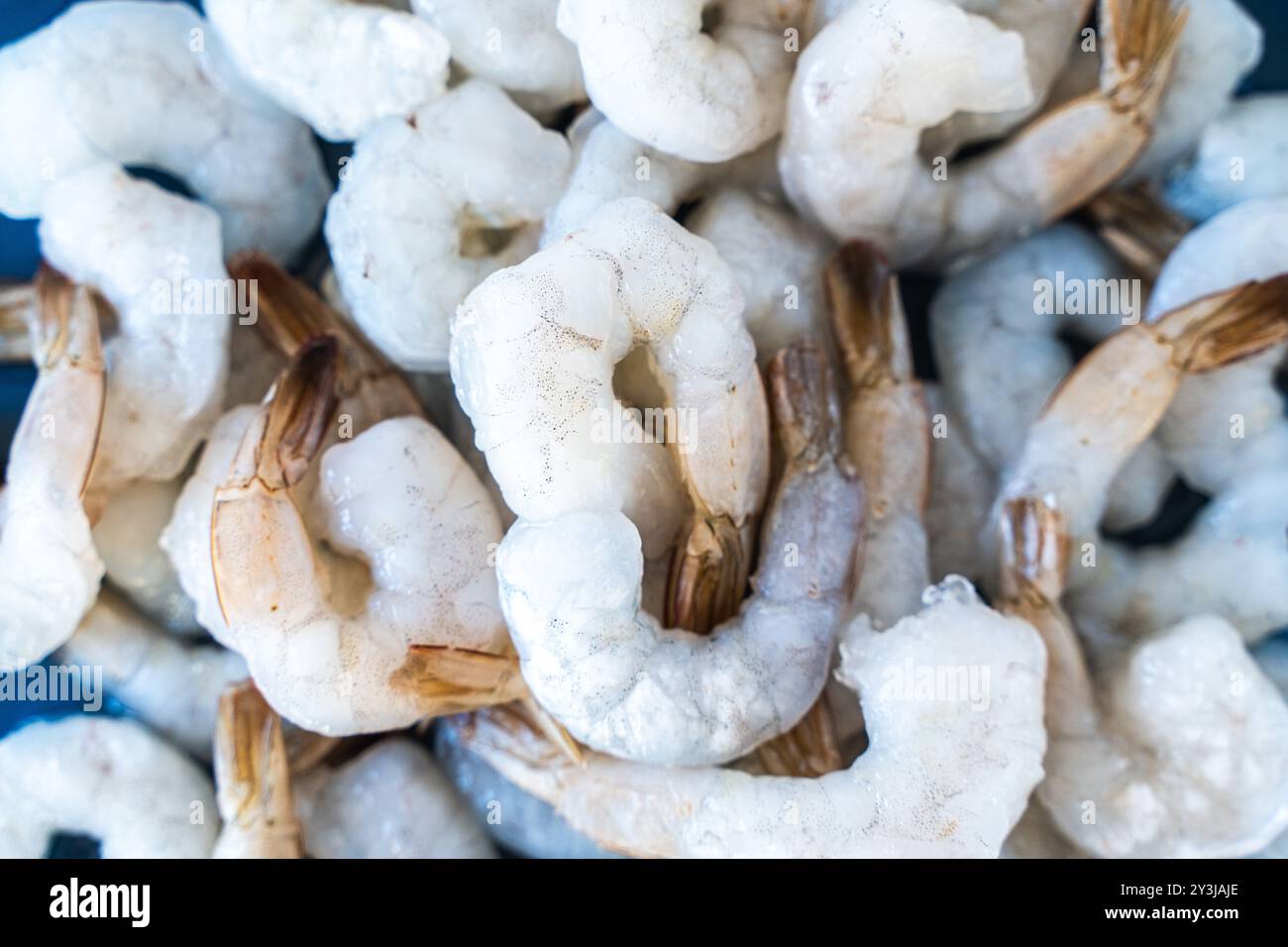 Frozen, raw shrimp. Texture: King Prawns background. Seafood on the ...